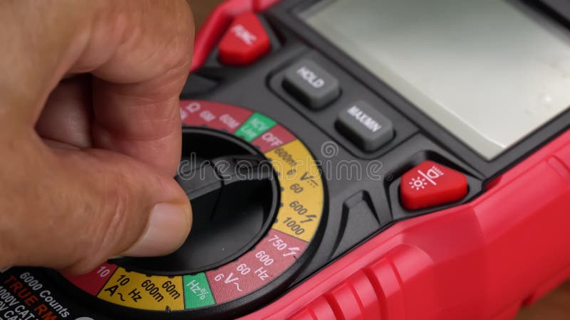 Closeup View of Man Turning Knob of Multimeter for Measuring Voltage ...