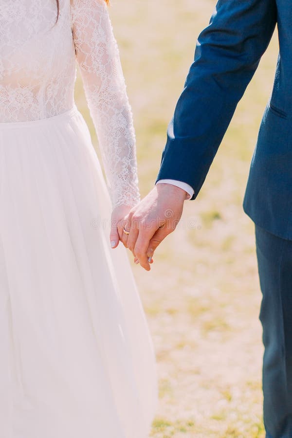 Closeup View of Married Bride and Groom Holding Hands Together Stock ...