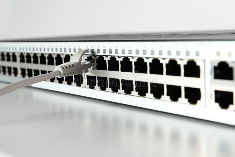 Closeup View of Network Switch with Cable on Light Background. Internet ...