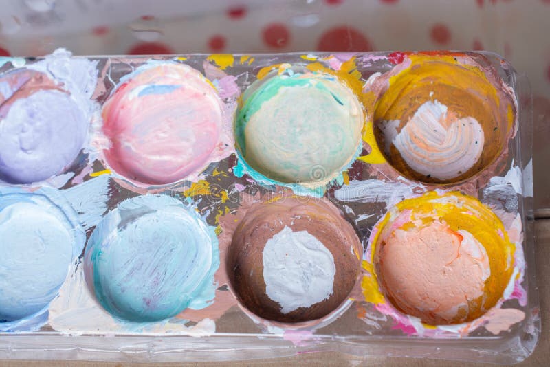 Closeup View of the Plastic Paint Containers with Various Mixed Colors ...