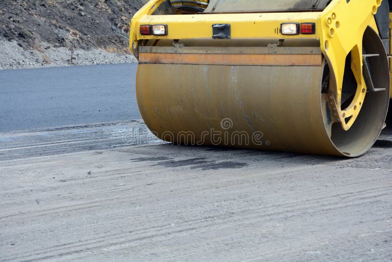 Closeup View on the Road Roller Working on the New Road Construction ...