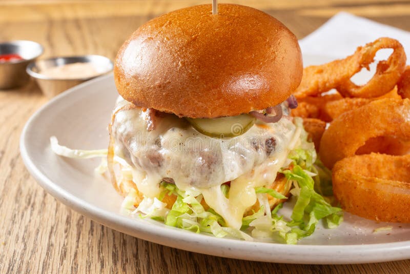 Thick cheeseburger plate stock photo. Image of hamburger - 239060278