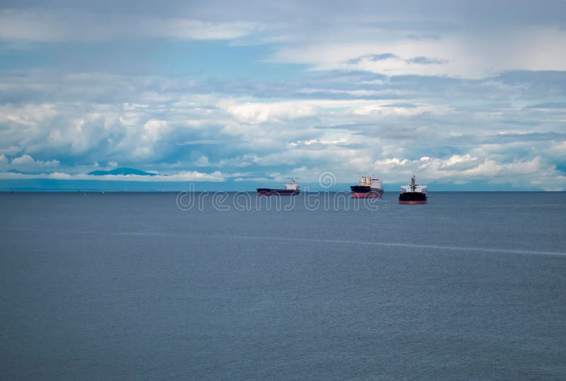 Closeup View of Three Ship Sailing on the Horizon on the Fluffy White ...
