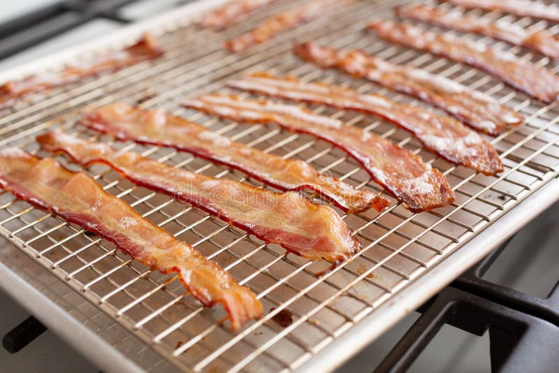 Baked bacon on tray stock photo. Image of oven, grass - 240464848