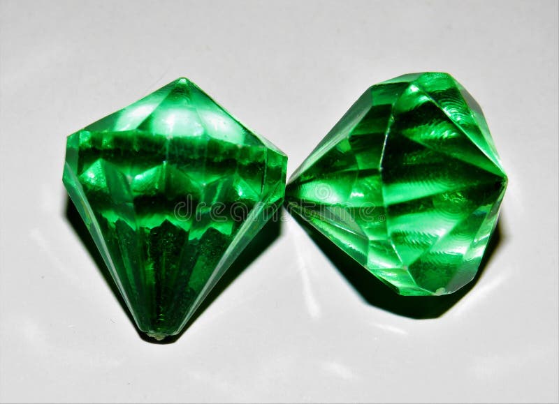 Closeup View of Two Green Crystals on a Light Grey Surface - Concept ...
