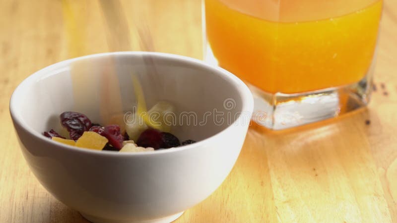 Closeup View of Various Dried Tropical Fruit Falling into White Ceramic ...