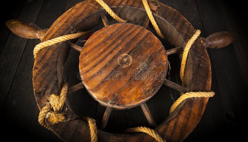Closeup View of Vintage Ship Wheel with Ropes Around Stock Photo ...