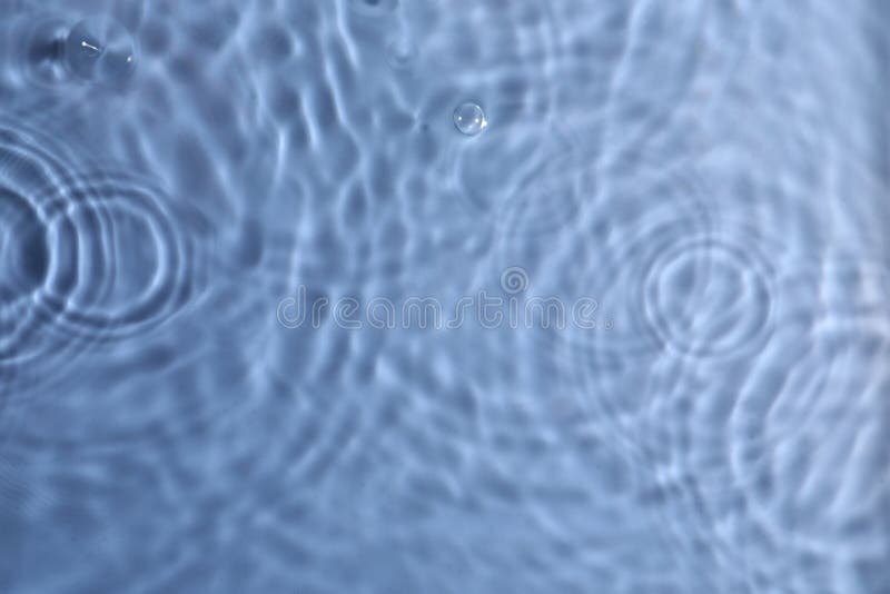 Closeup View of Water with Rippled Surface on Blue Background Stock ...