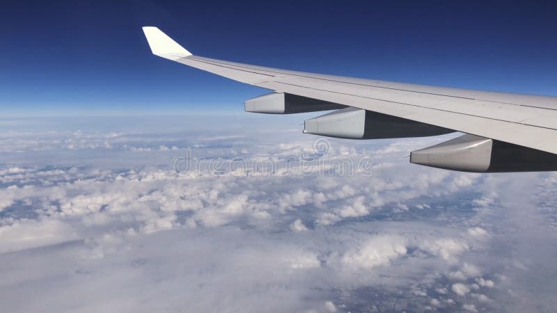Closeup View of a White Plane Flying Above the Clouds Stock Video ...