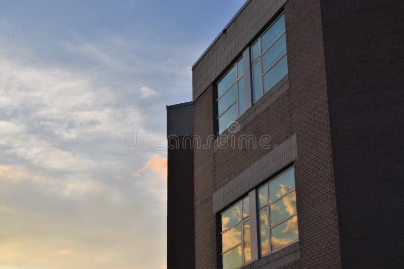 A Sunset Reflected Off Windows Stock Image - Image of blue, modern ...