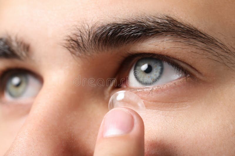 Closeup View of Young Man Putting in Contact Lens Stock Image - Image ...