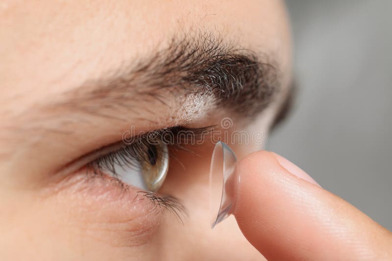 Closeup View of Young Man Putting in Contact Lens Stock Image - Image ...