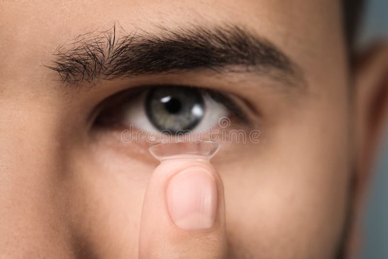 Closeup View of Young Man Putting in Contact Lens Stock Image - Image ...