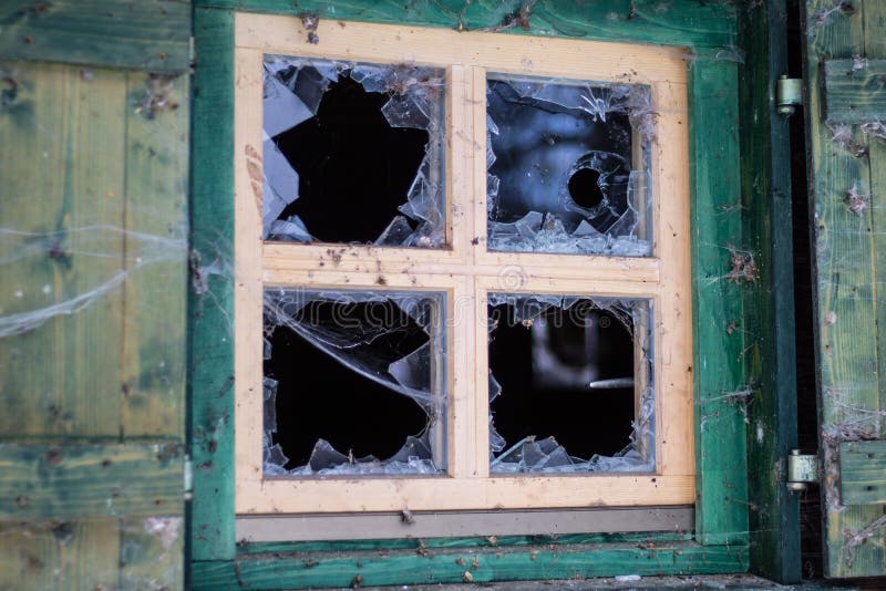 Closeup of a Vintage Broken Window with Green Walls Around Stock Photo ...