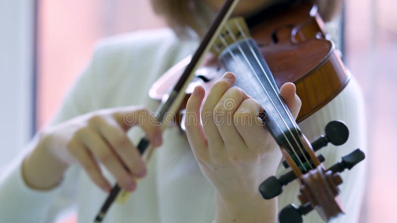 Closeup Violin with Bow Glide Smoothly on Strings, Performer Precision ...