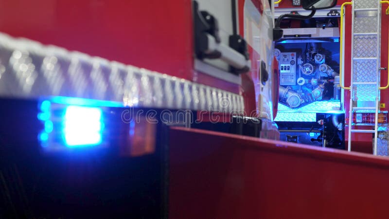 Fire Truck with Flashing Red and Blue Lights Parked in a Dark Area ...