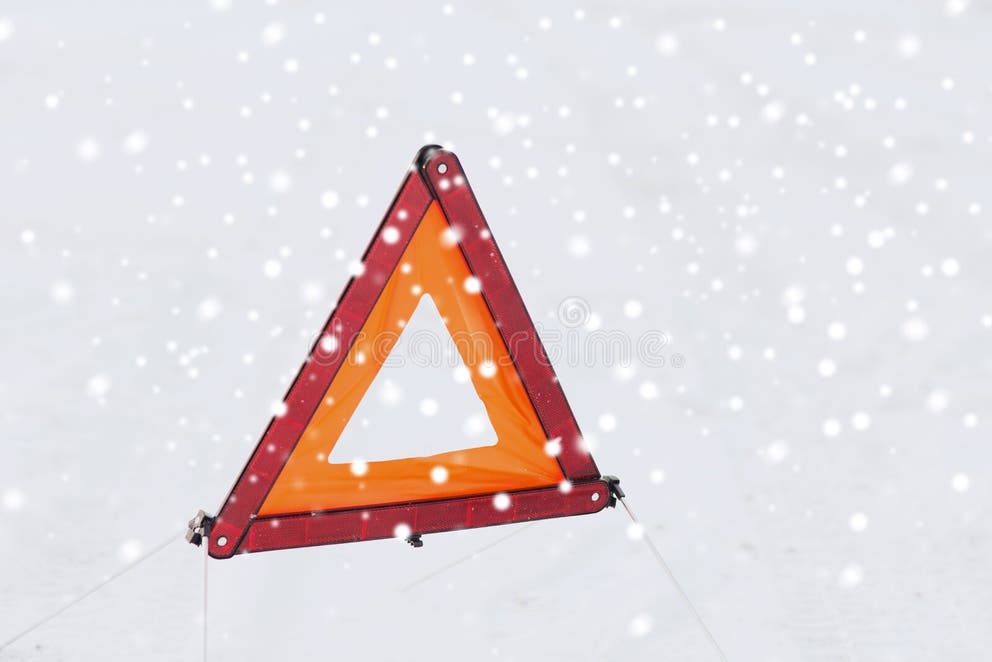 Closeup of Warning Triangle on Snow Stock Photo - Image of accessory ...