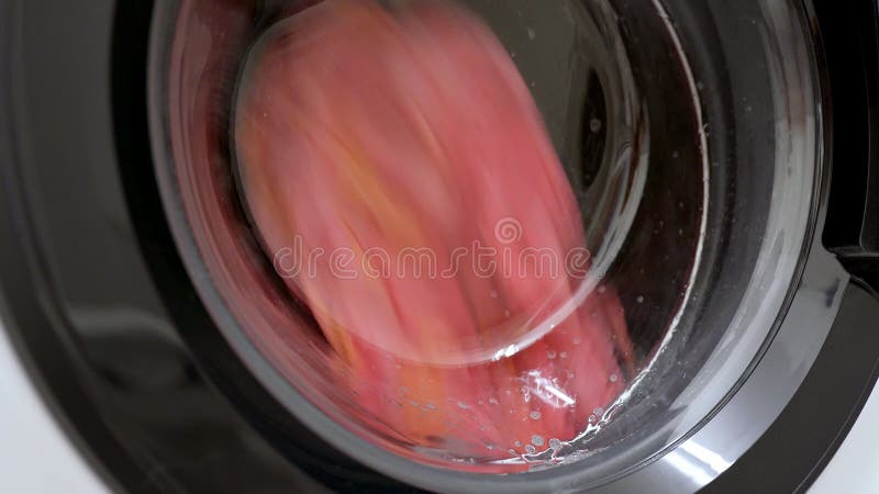 Closeup of Washing Machine Door with Spinning Laundry Stock Footage ...