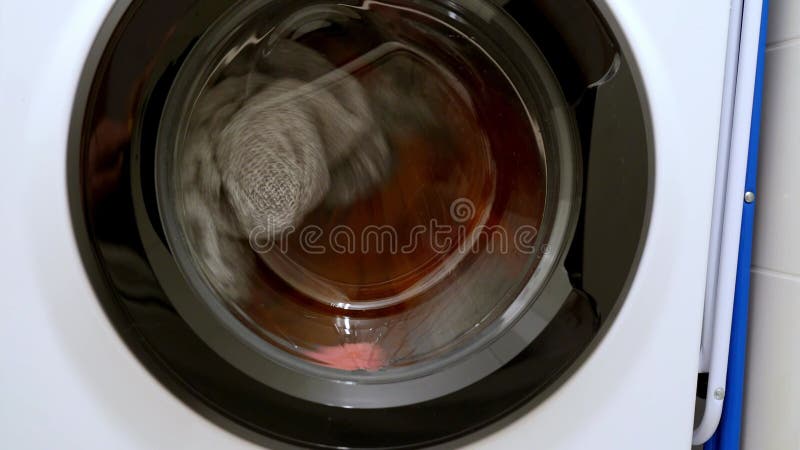 Closeup of Washing Machine Door with Spinning Laundry Stock Footage ...