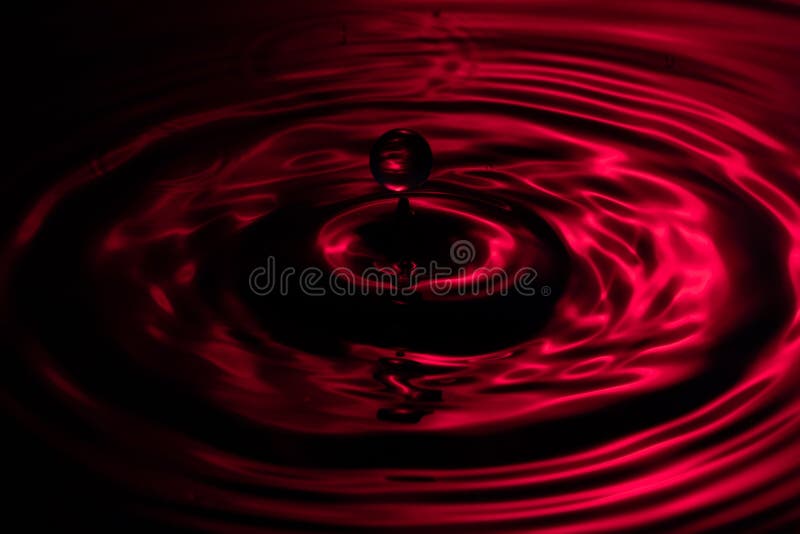 Closeup of Water Drop Splash Under the Red Lights - Perfect for ...
