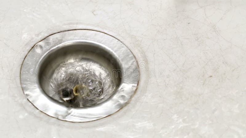 Closeup of Water Going Down the Drain in Kitchen Sink Stock Video ...