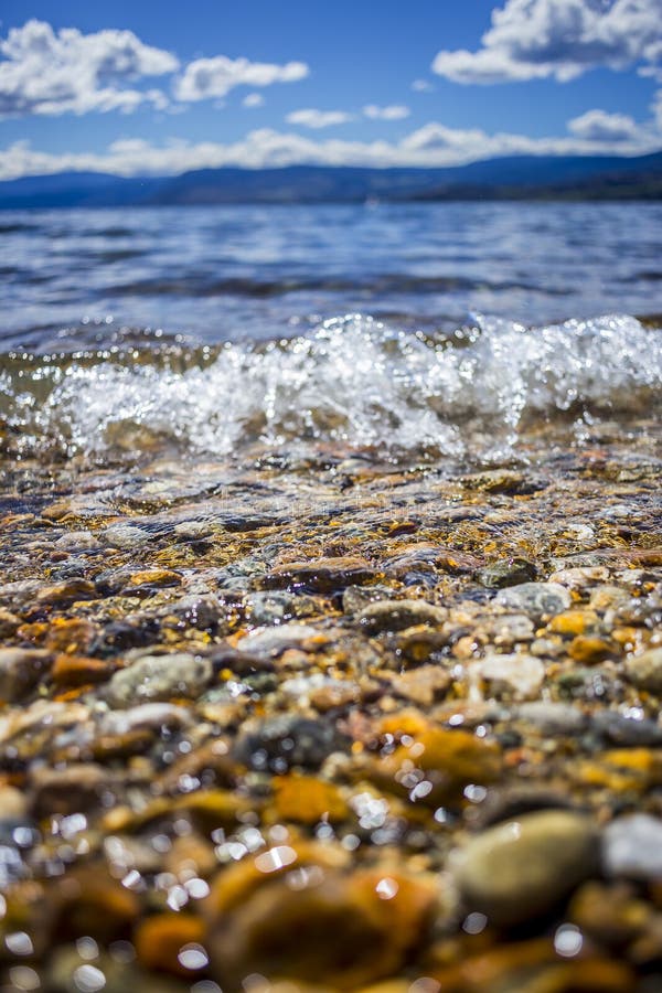 Closeup of Waves Rolling into Beach Shoreline Stock Photo - Image of ...