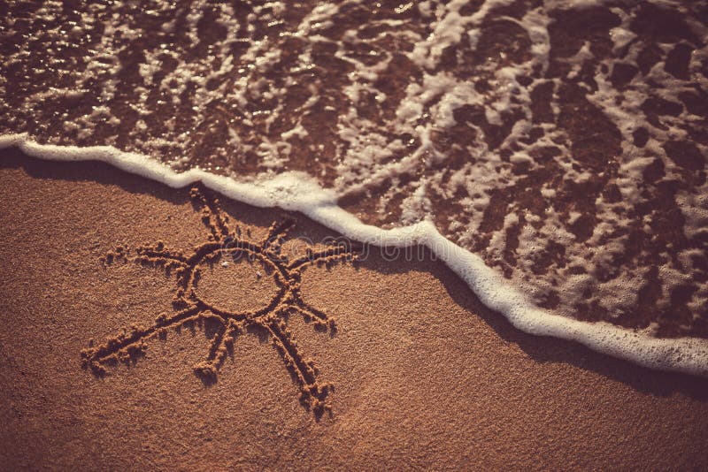 Closeup Waves and Sun Drawing on the Sand Beach Near the Ocean. Stock ...