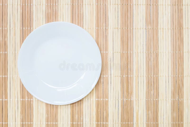 Closeup White Ceramic Dish on Wood Mat Textured Background on Dining ...
