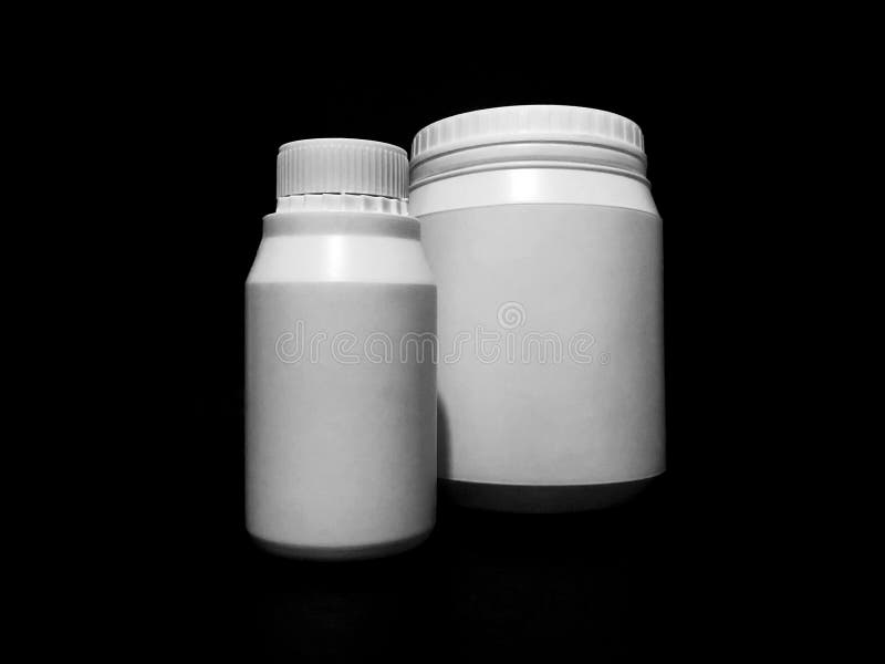 Closeup of White Empty Plastic Bottles on a Dark Background Stock Image ...