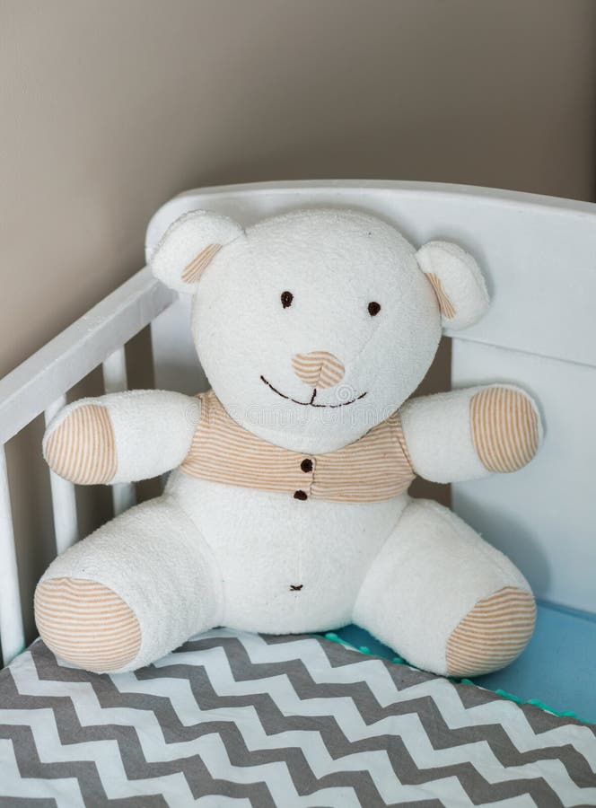 Closeup of a White, Soft Teddy Bear in a Baby Crib Stock Image - Image ...
