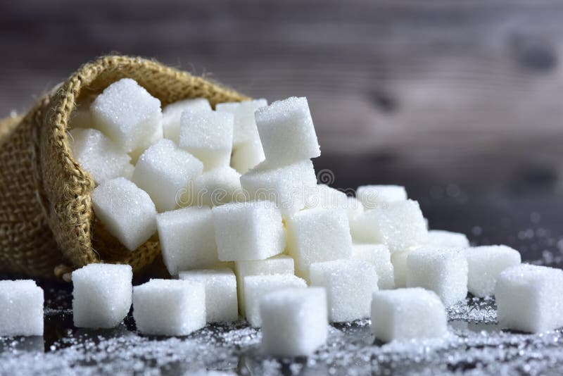 Closeup White Sugar Cubes and Refined Sugar in Burlap Sack Bag on a ...