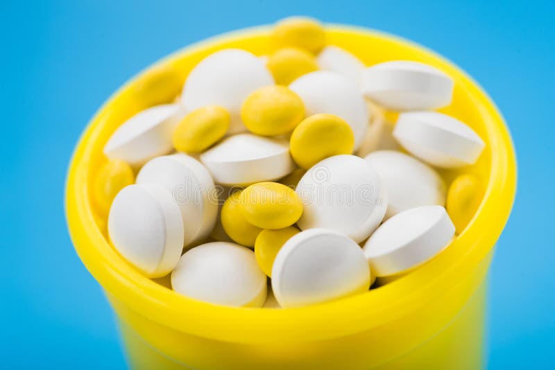 Closeup of White and Yellow Vitamins Pills Stock Photo - Image of ...