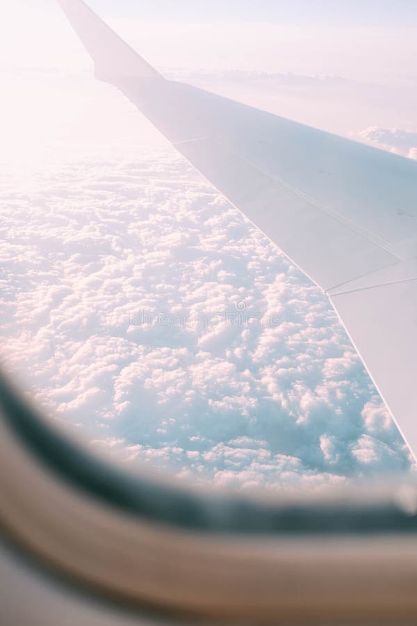 Closeup of the Wing of a Plane Still in the Air with a View of Clouds ...