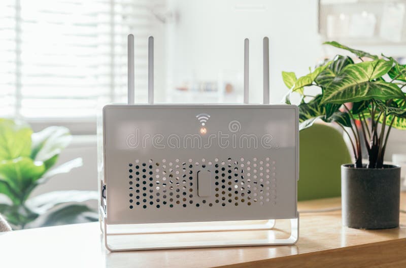 Closeup of a Wireless Router and Laptop Computers on Living Room at ...