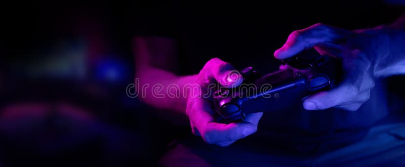 Closeup of Wireless Video Game Controller in Gamer Hands in Neon Lights ...