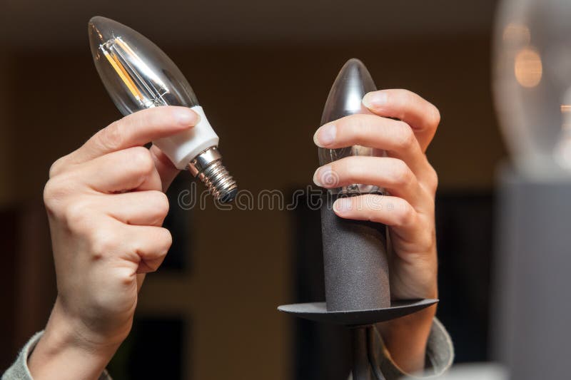Closeup, Woman Changing a Light Bulb, Energy Saving Lamp Stock Image ...