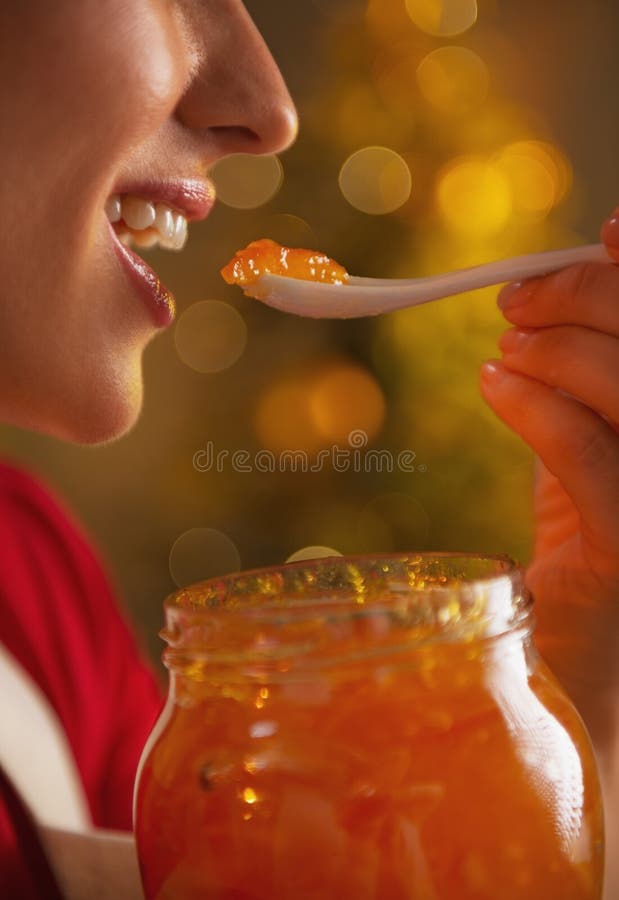 Closeup on Woman Eating Orange Jam Stock Photo - Image of closeup ...