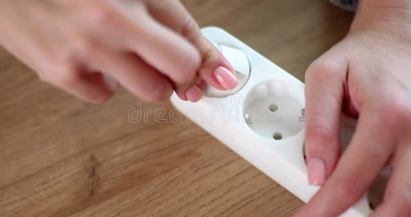 Closeup of Woman Hand Inserting Plug into Socket Stock Footage - Video ...
