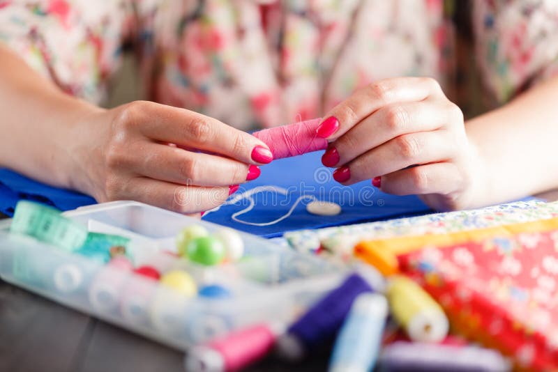 Closeup of Woman Hands Sewing a Button Stock Photo - Image of sewing ...
