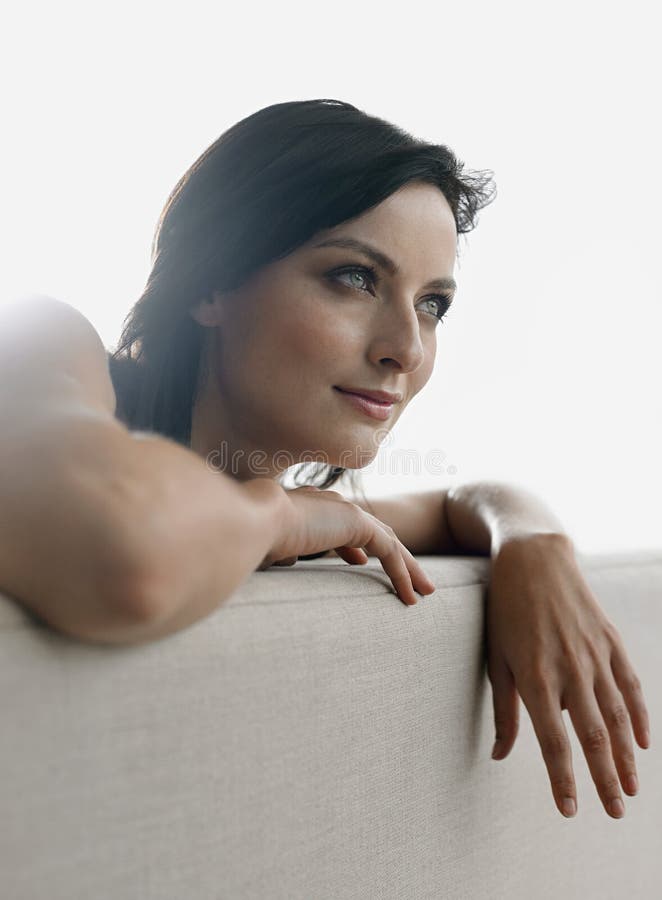 Closeup of Woman Leaning on Couch Stock Photo - Image of closeup ...