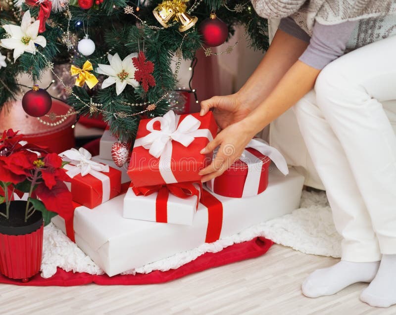 Closeup on Woman Taking Present Box from Under Christmas Tree Stock ...