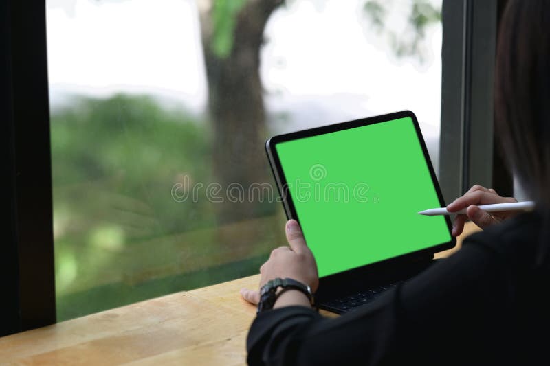 Closeup Woman Using Stylus Pen on Green Screen of Digital Tablet. Stock ...