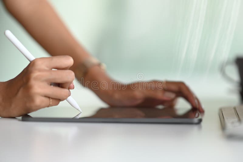Closeup Woman Working on Digital Tablet Using Stylus Pen. Stock Image ...