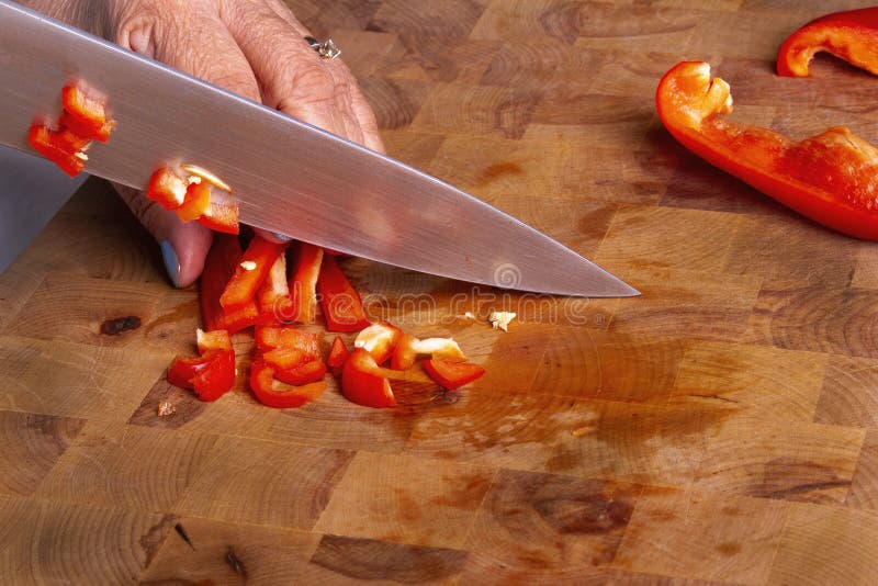 Chopping a red pepper stock photo. Image of chopped - 237299054
