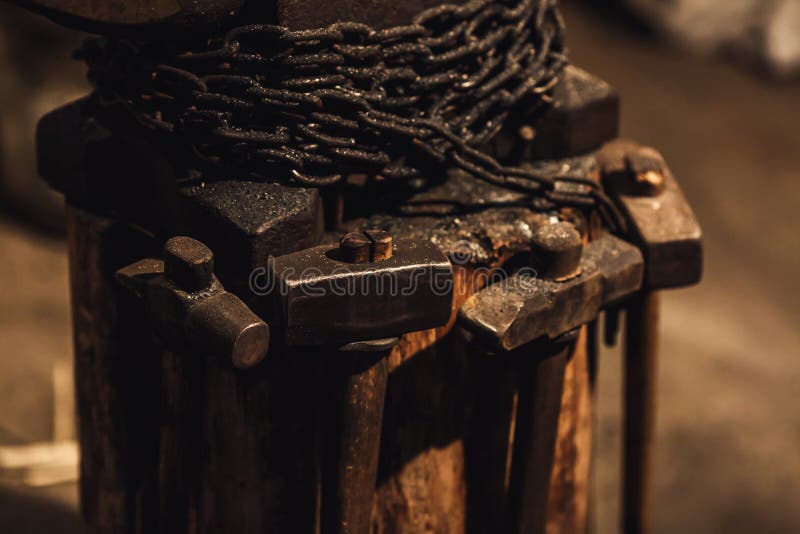 Closeup Wooden Deck with Anvil, Chain and Hammers Stock Image - Image ...