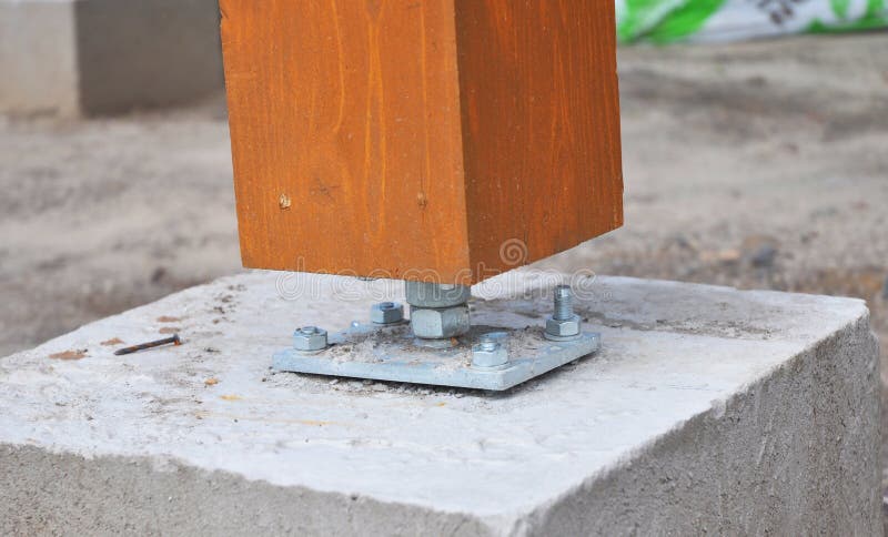 Closeup of Wooden Pillar on the Construction Site with Screw. Stock ...