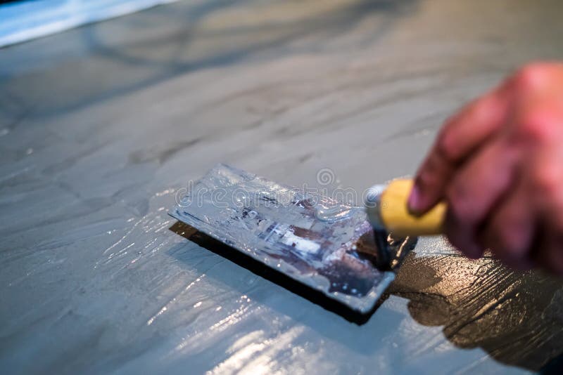 Closeup Worker Applying Micro Concrete Plaster Coating on the Kitchen ...