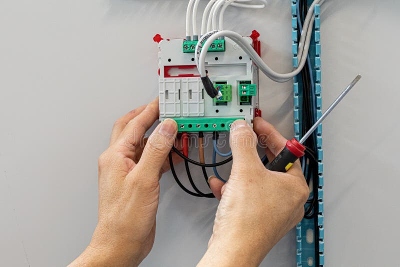 Closeup of a Worker S Hands Inserting Block Connector into a Measuring ...