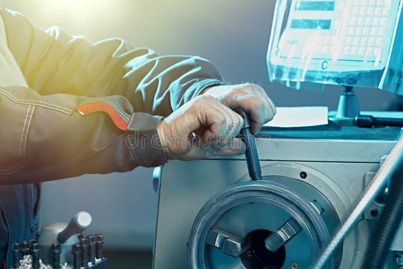 A Closeup of a Worker Sets a Workpiece in a Lathe Stock Image - Image ...