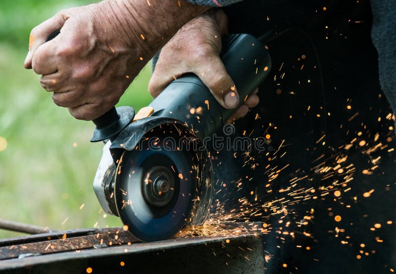 Closeup of Worker Using a Grinder on a Metal Plate Stock Image - Image ...